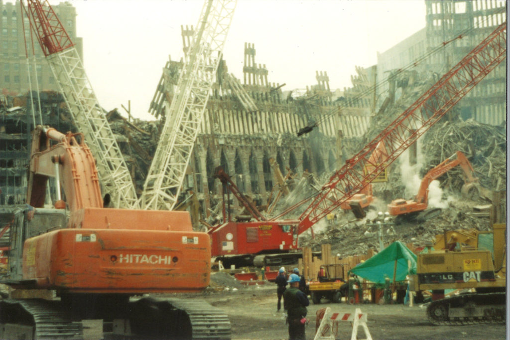 Cranes and heavy machinery removing destroyed buildings at Ground Zero ...