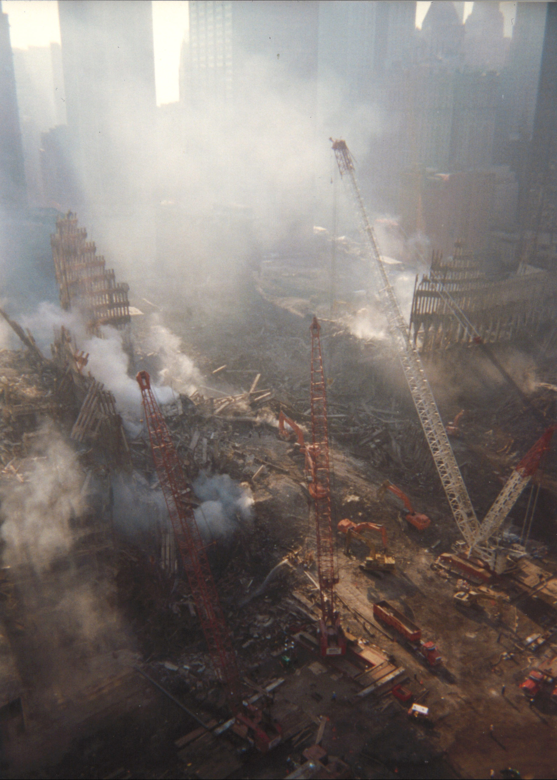 Overview of Ground Zero with Smoke and Cranes - Village Preservation