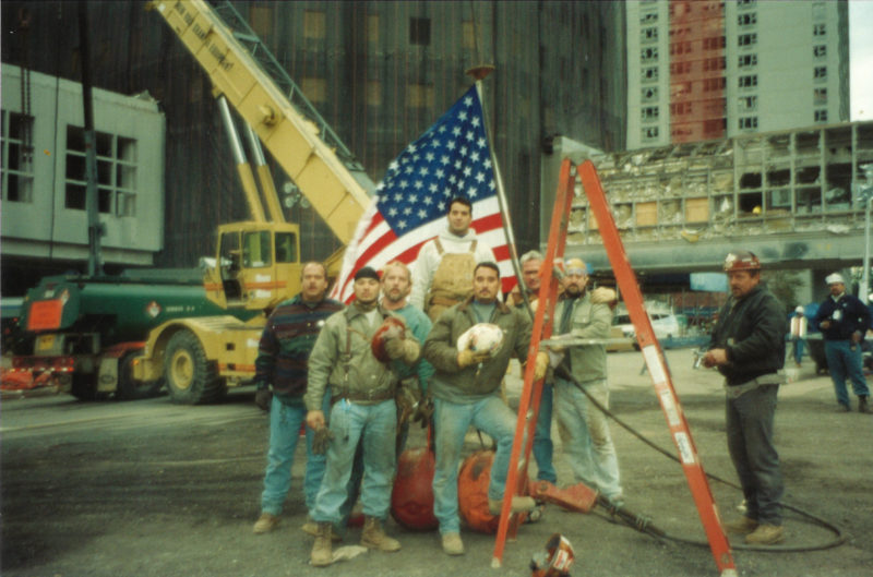 Workers at Ground Zero with the Flag - Village Preservation