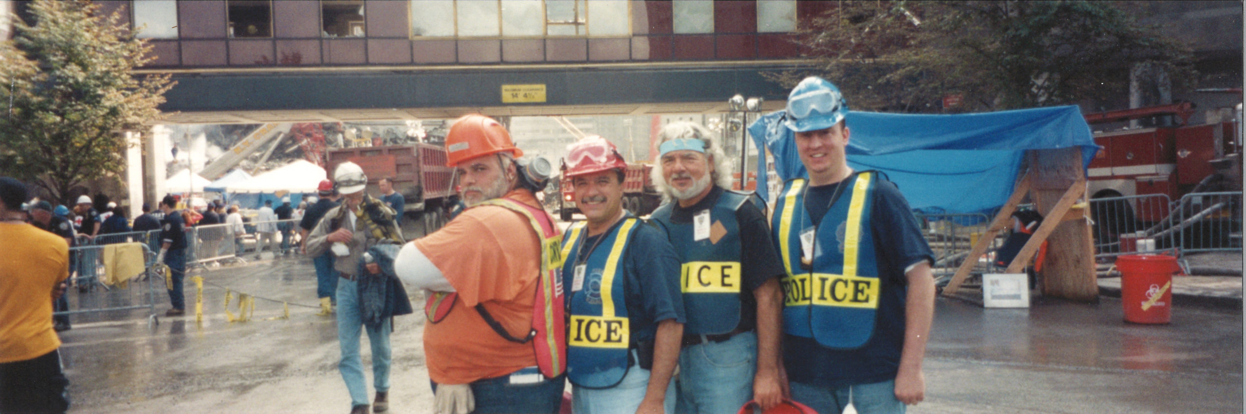 A Contractor and Three Police Officers Take a Photo - Village Preservation