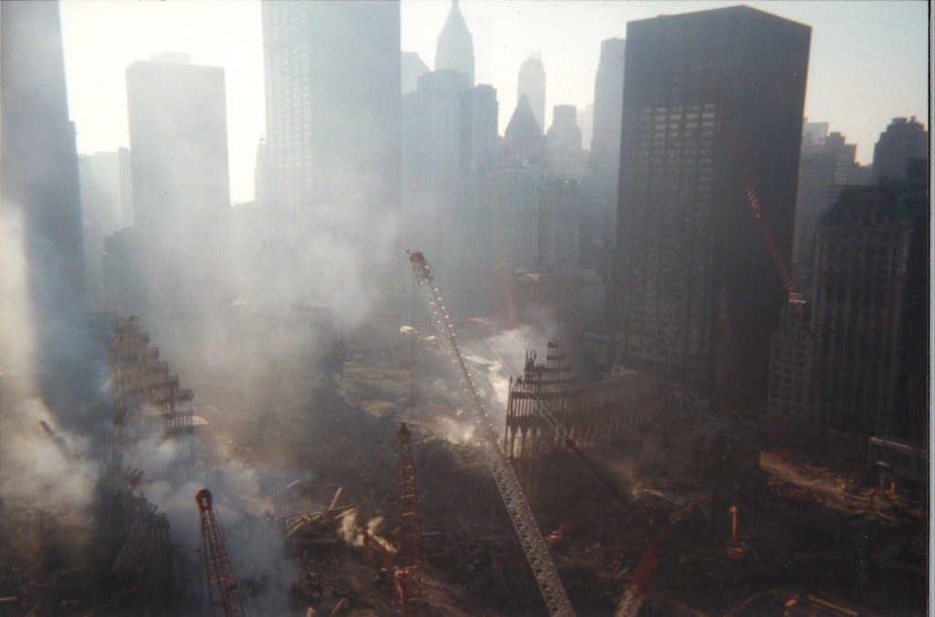 Aerial View of Exoskeleton of WTC 1 and 2 Surrounded by Smoke and ...