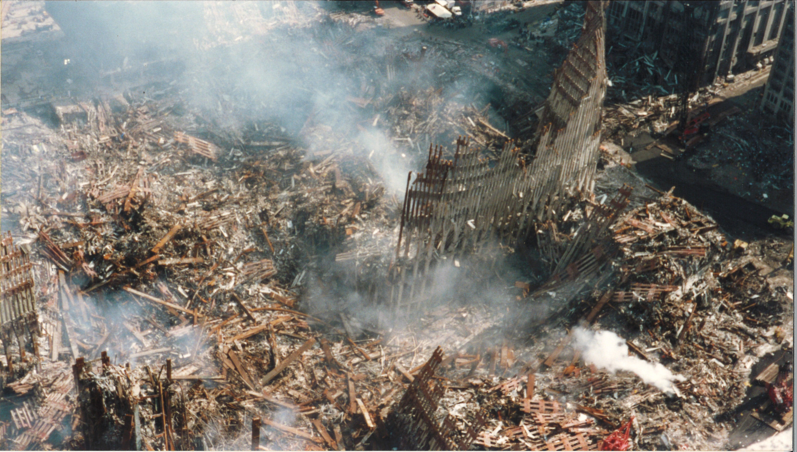 Ariel View of Ground Zero with Smoking Debris - Village Preservation