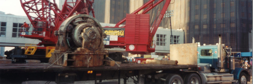 Flatbed Carrying a Crane and a Motor to Ground Zero - Village Preservation