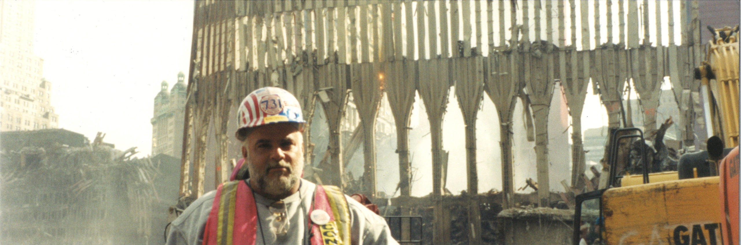 A laborer from Local 731 in front of Exoskeleton - Village Preservation