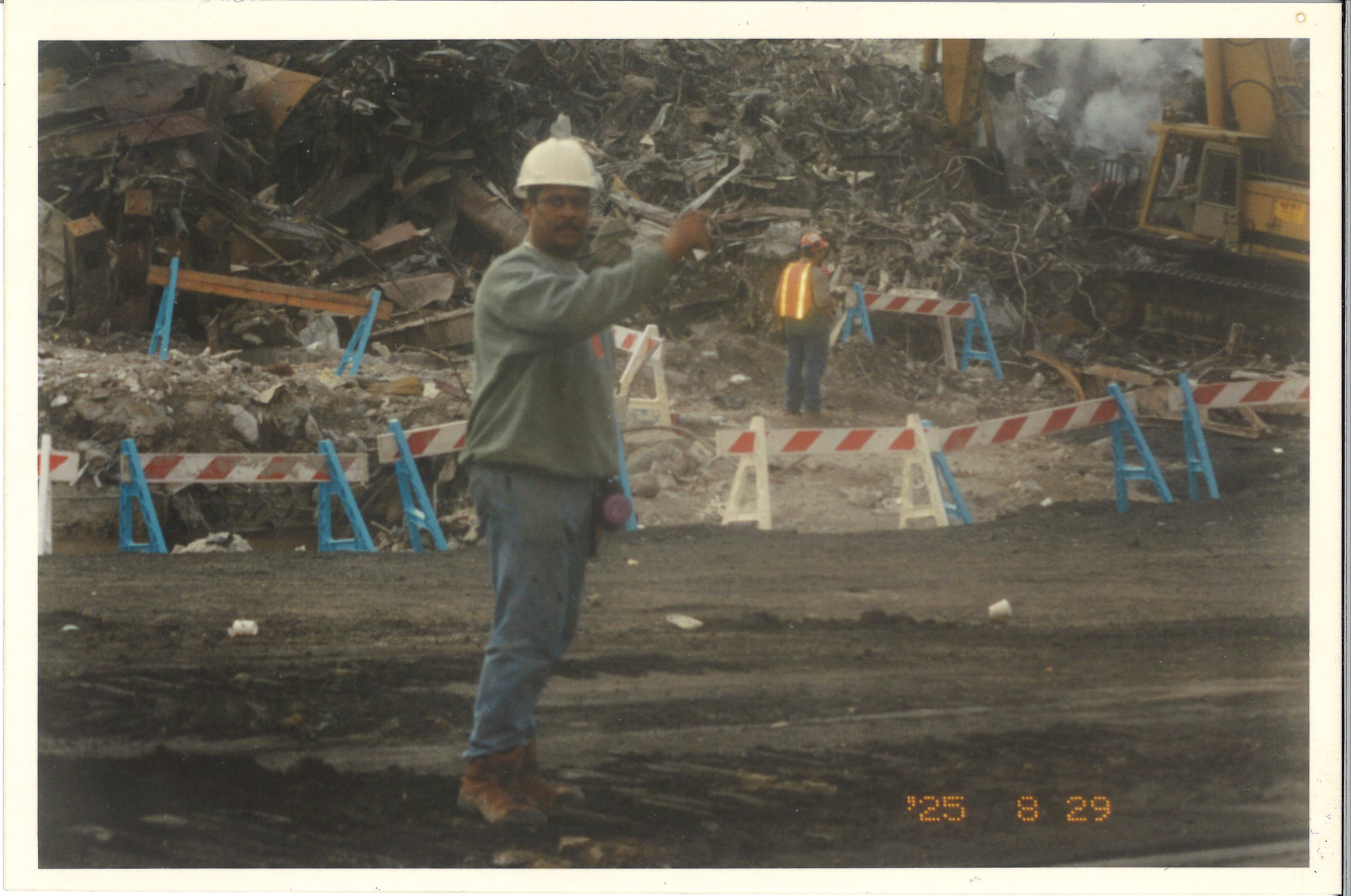Photo of an Unknown Worker Pointing at Ground Zero - Village Preservation