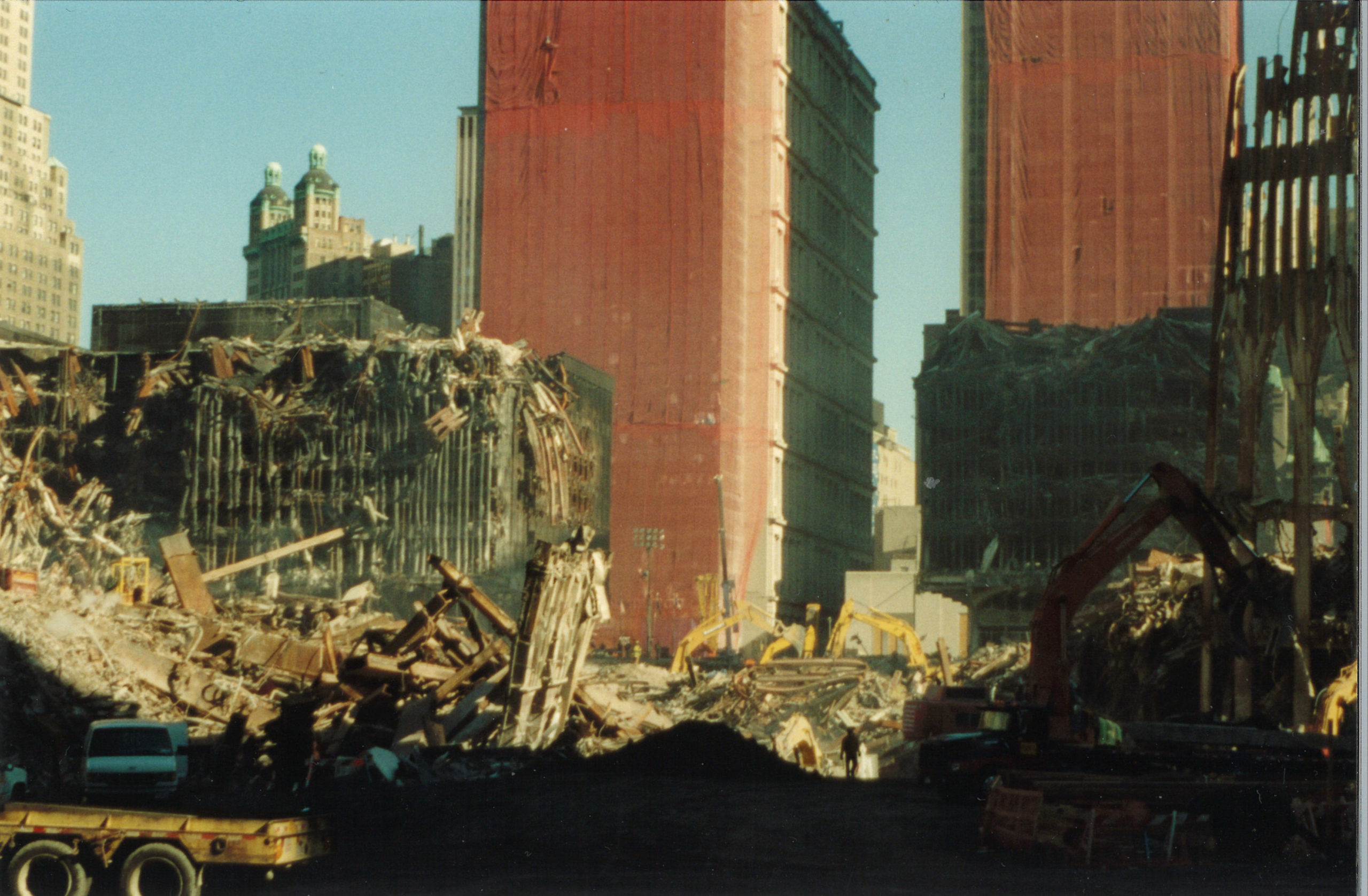 Rubble at Ground Zero with WTC 4 and 5 Falling Down - Village Preservation
