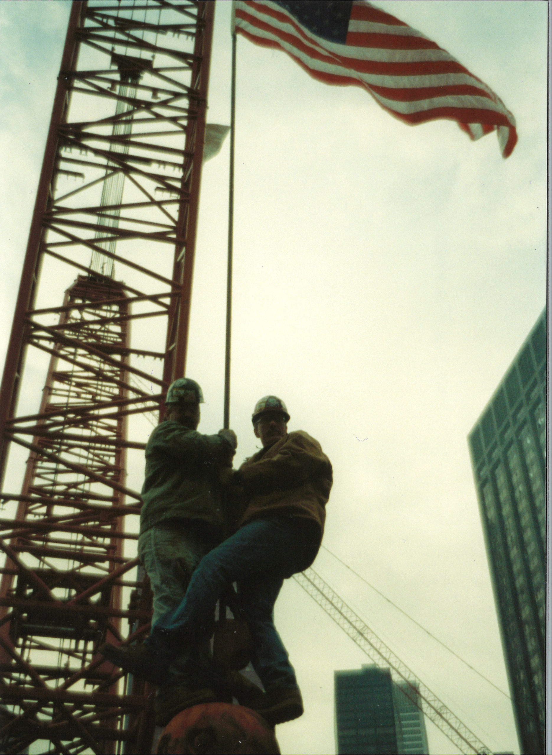 Two Unknown Workers Hanging on a Crane Hoist at Ground Zero - Village ...