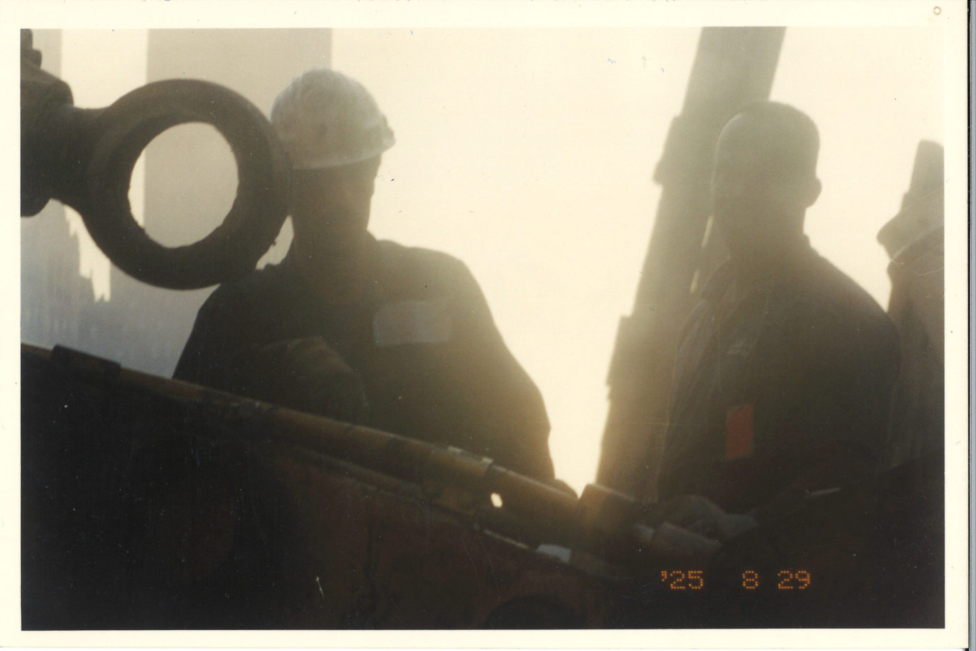 Two Workers with the Sun from Behind at Ground Zero - Village Preservation