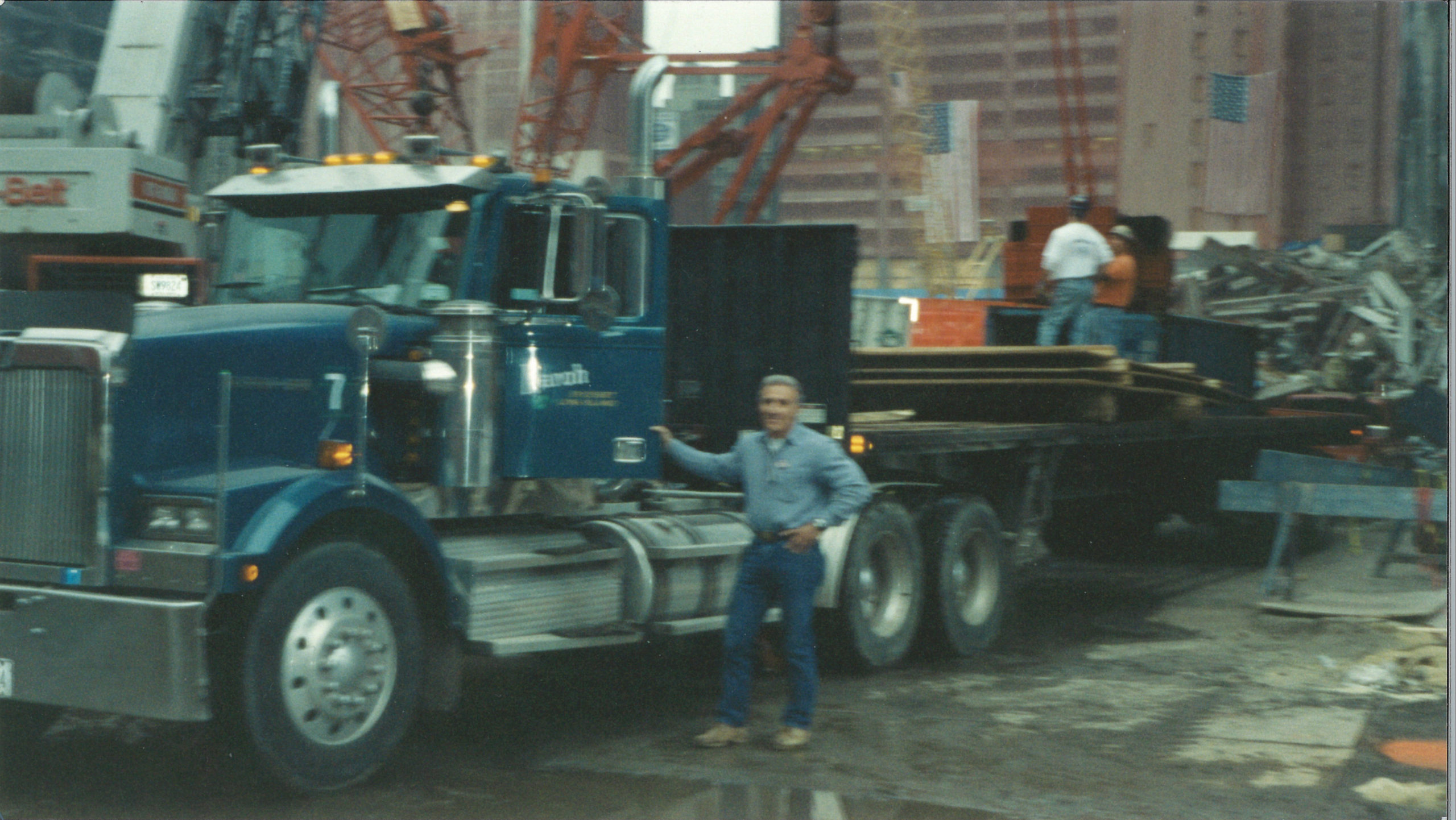 Unknown Driver Standing with a Flatbed Truck at Ground Zero - Village ...