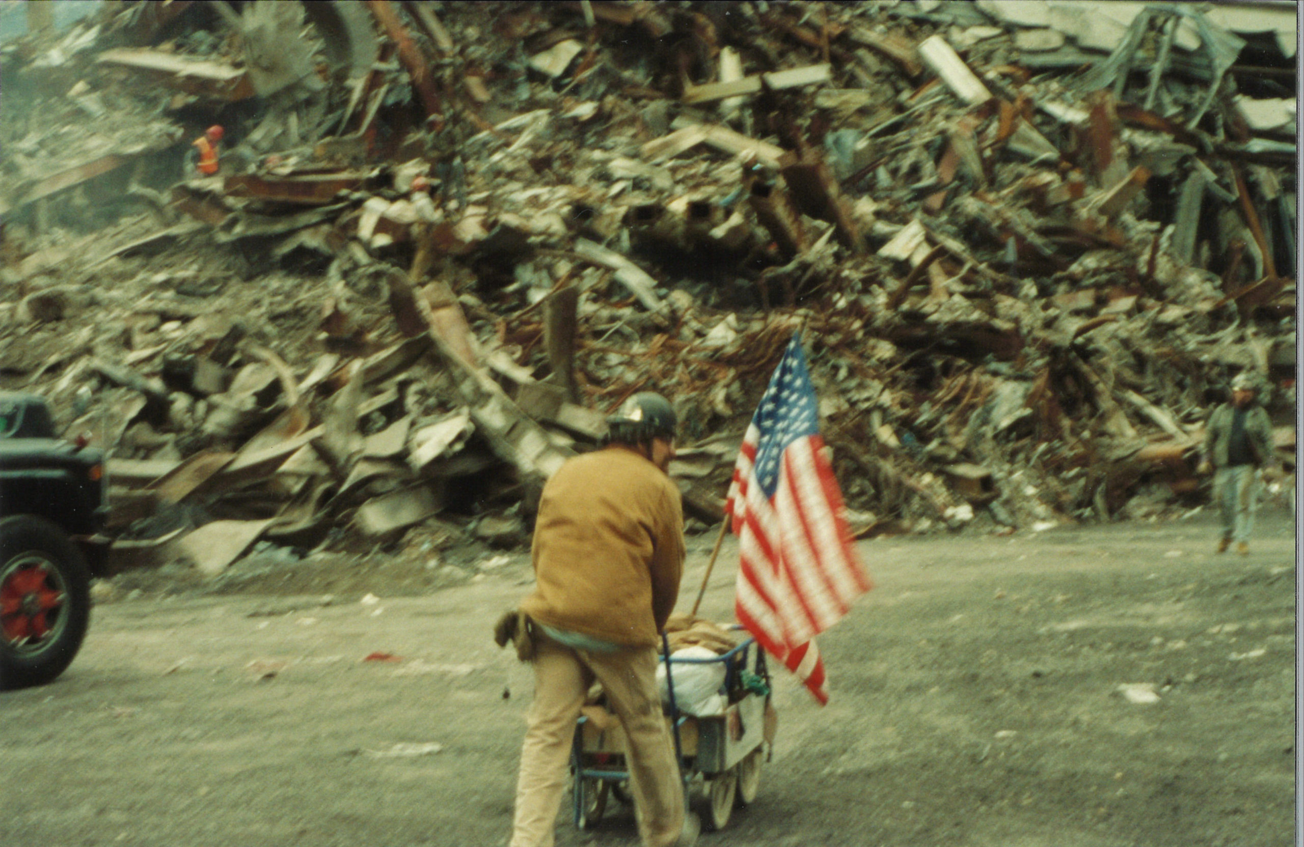 Unknown Worker Moving Materials with an American Flag On the Cart ...