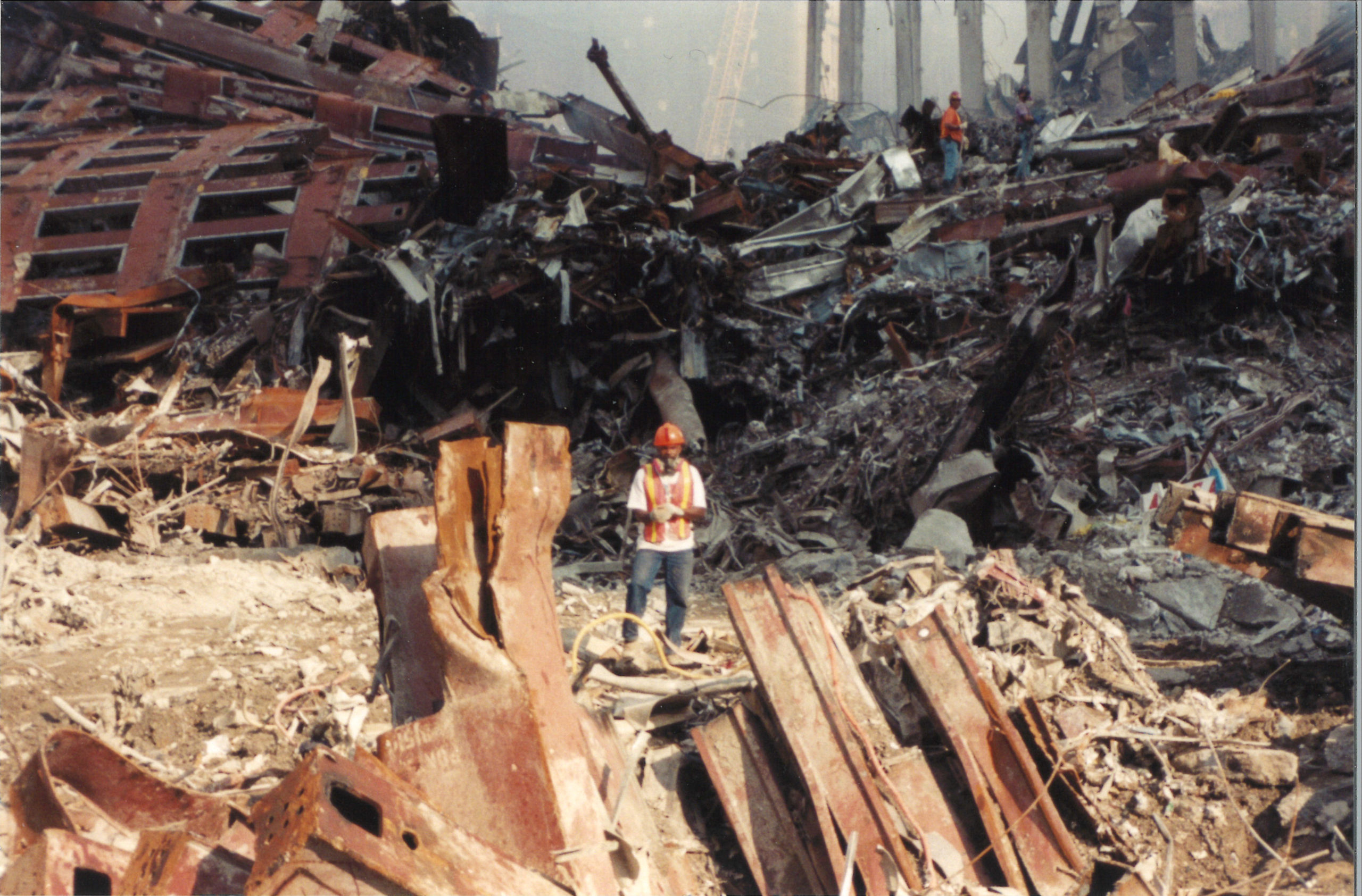 Unknown Worker Standing in Debris at Ground Zero - Village Preservation