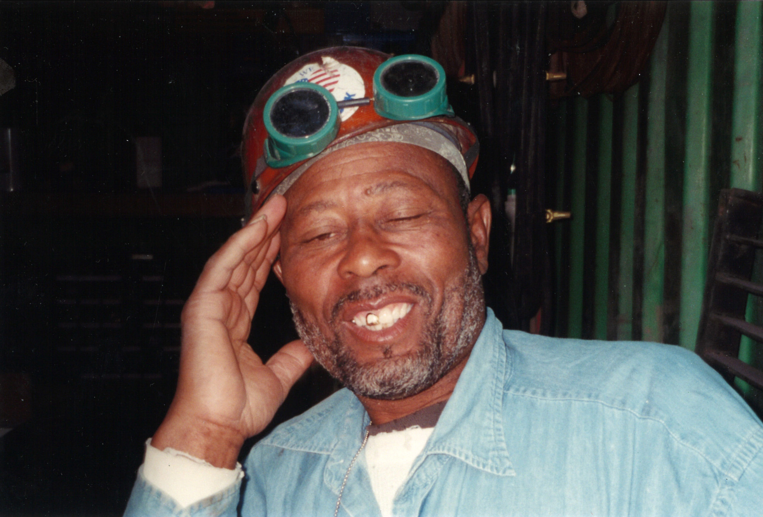 Close up photo of An Unknown Worker Smiling at Ground Zero - Village ...
