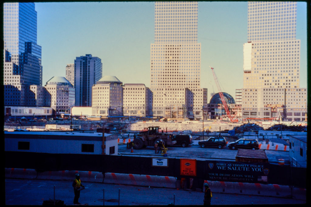 Construction Workers and Vehicles Work Behind Barricades at the WTC ...