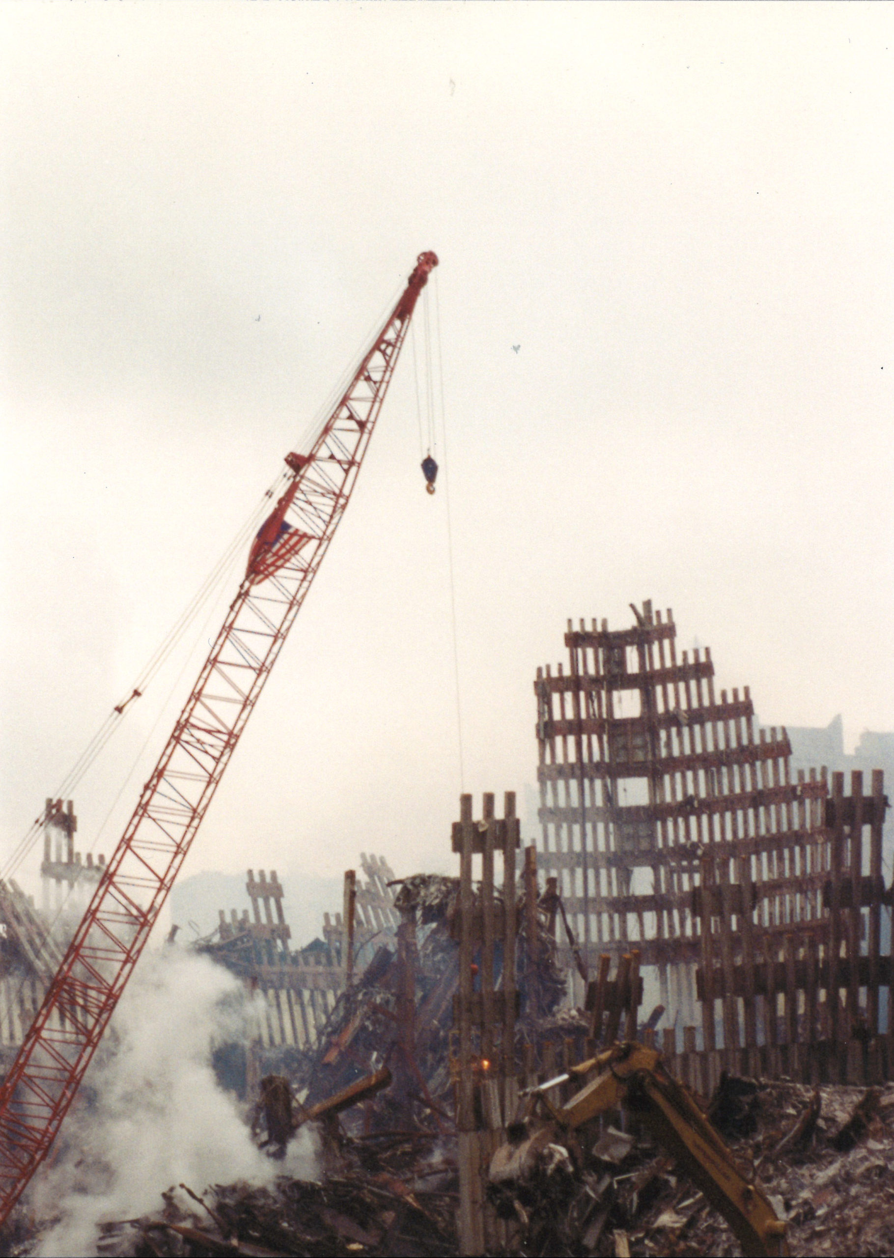 Crane and Digger Working in the Smoke and Debris at Ground Zero ...