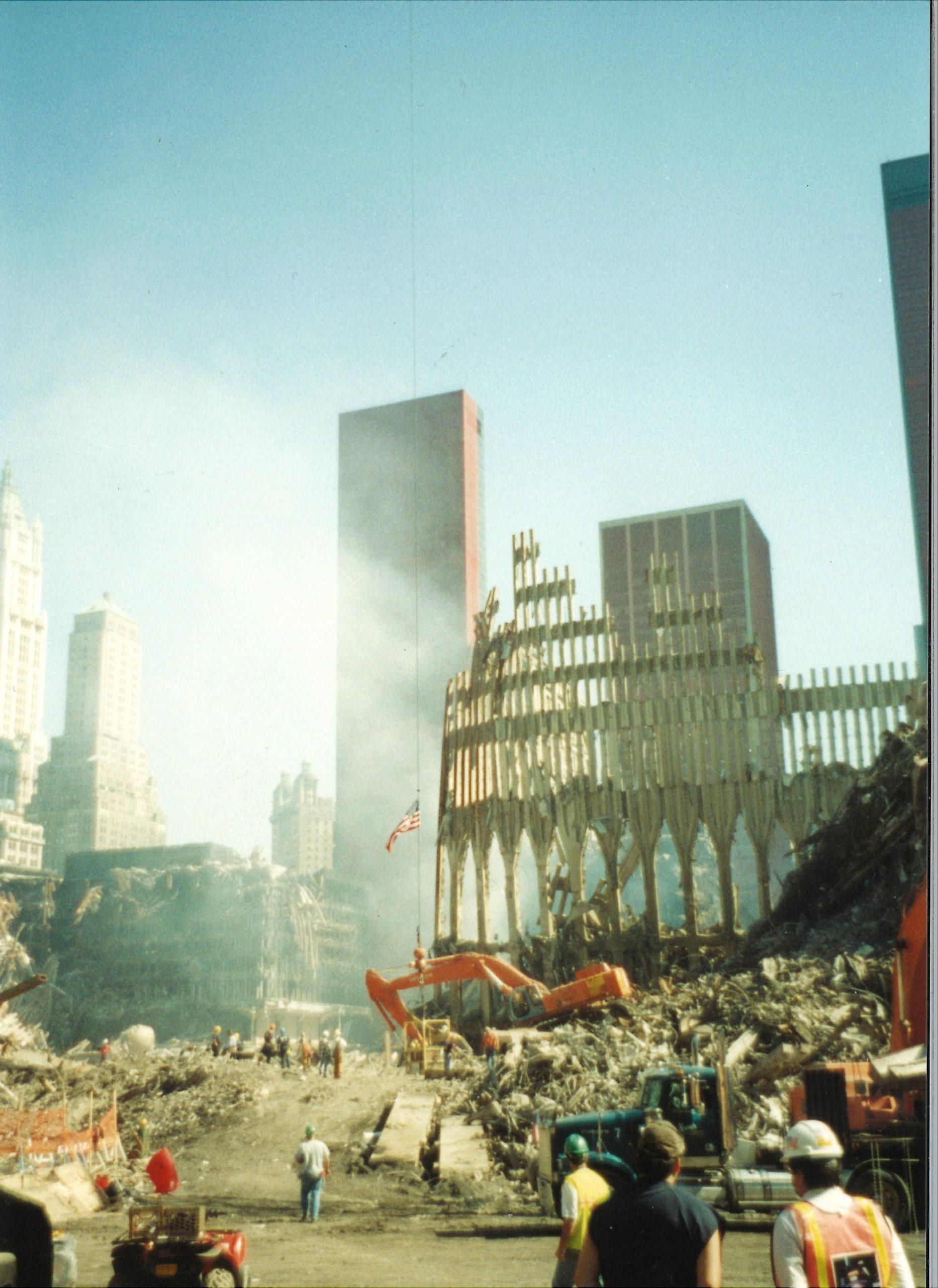 Destruction at Ground Zero with Workers Overlooking - Village Preservation