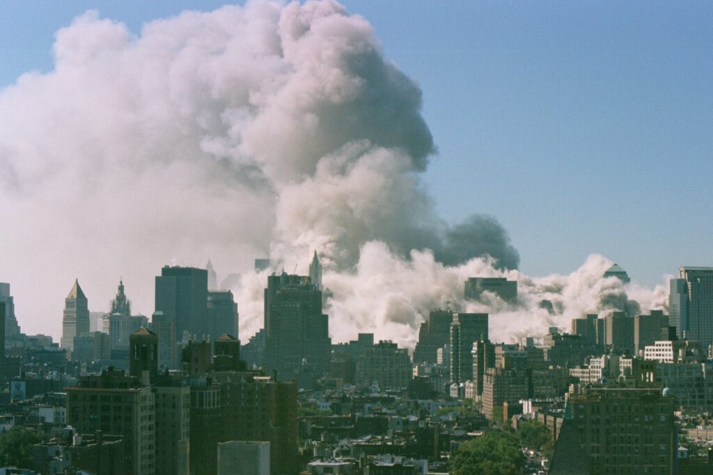 Smoke covers Lower Manhattan after 9/11 attacks, as seen from a 6th Ave ...