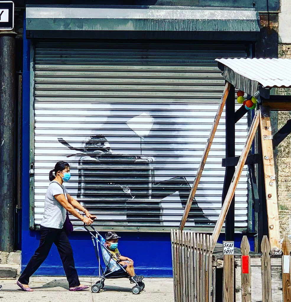 Masked Mother And Child Passing Maxell Man - Village Preservation