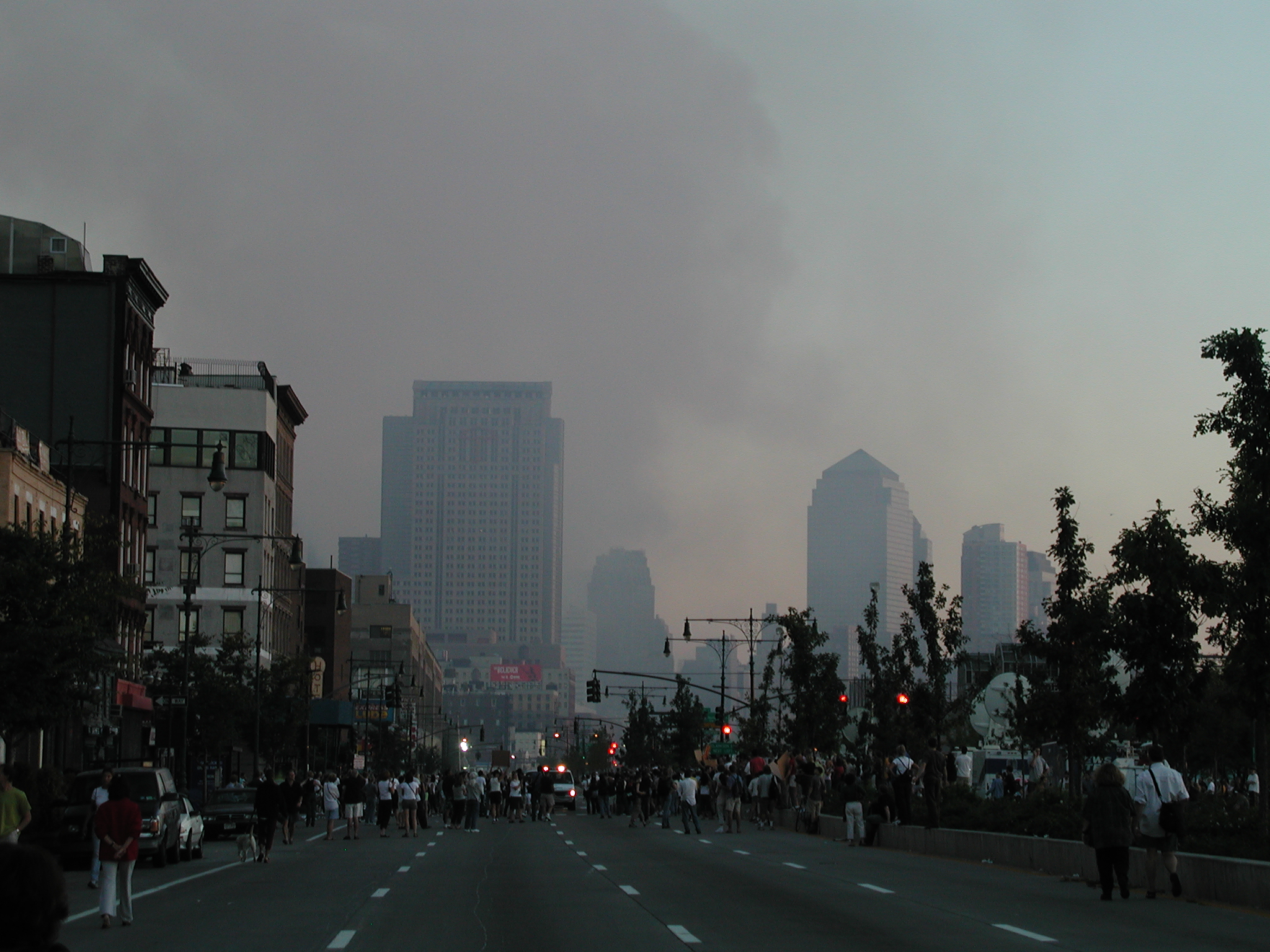 People watch smoke from September 11th attacks on West Street between ...