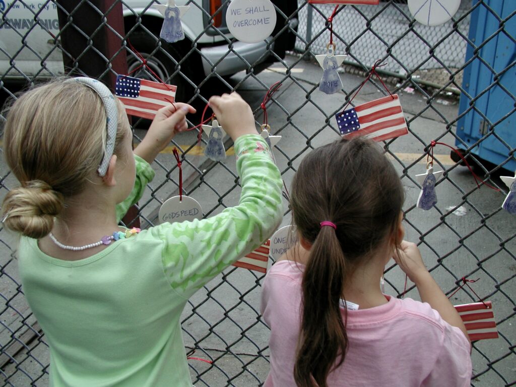 Children hang memorial tiles at Mulry Square, 7th Avenue South ...