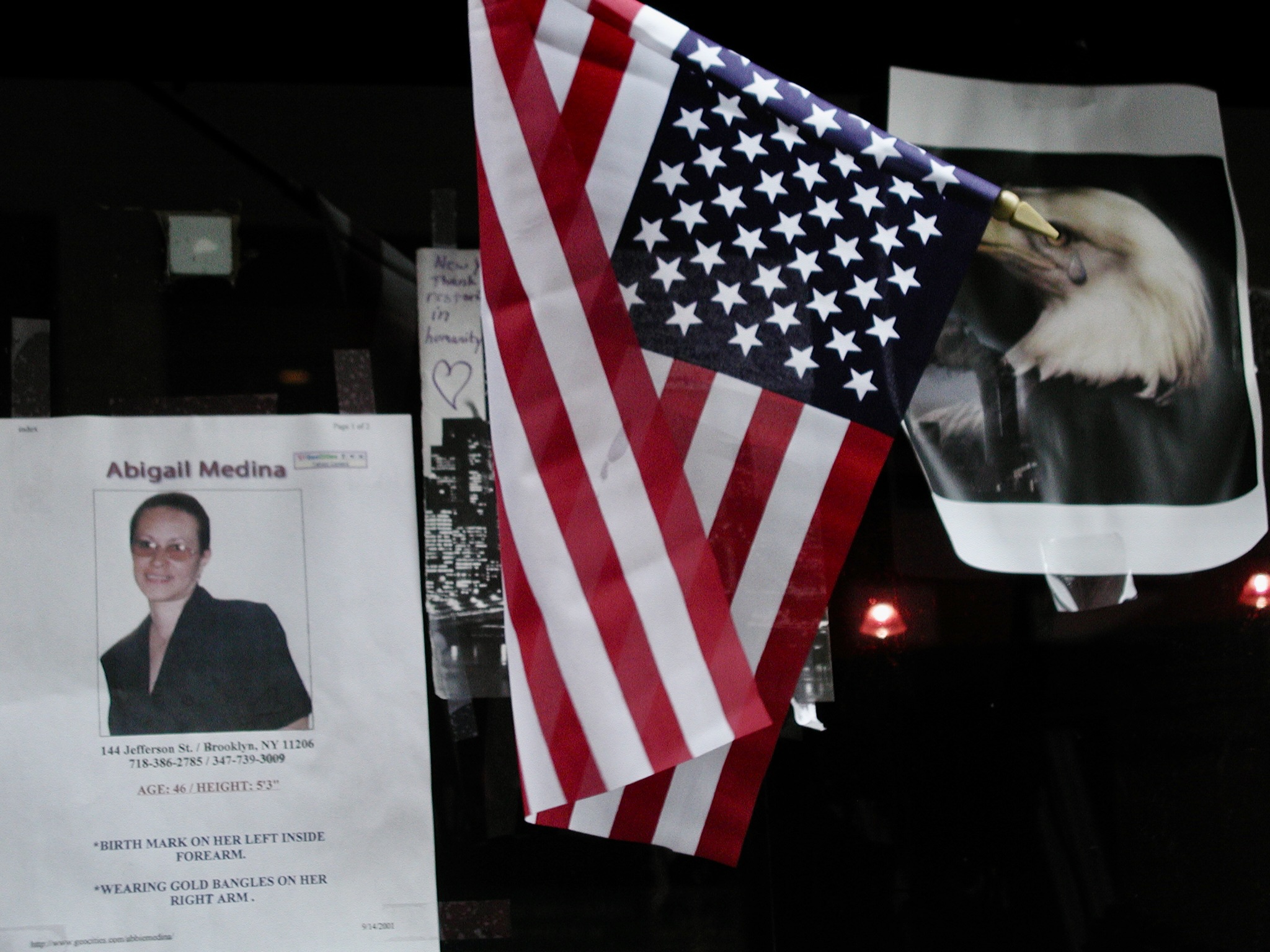 Missing person poster and American flag - Village Preservation