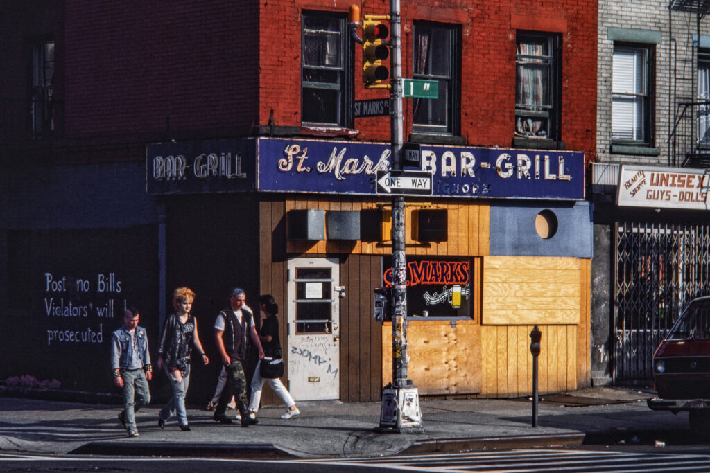 Street kids walking past St. Marks Bar & Grill, 1st Avenue and St ...